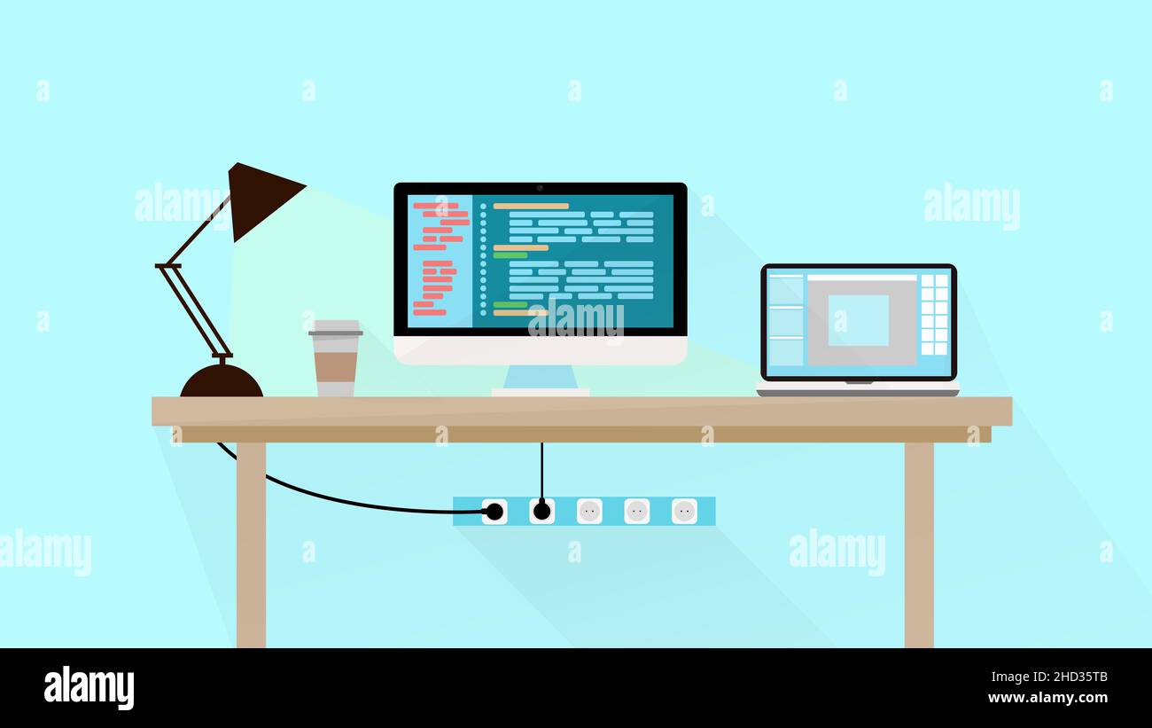 A desk setup consisting of a lamp and computers on a light green ...