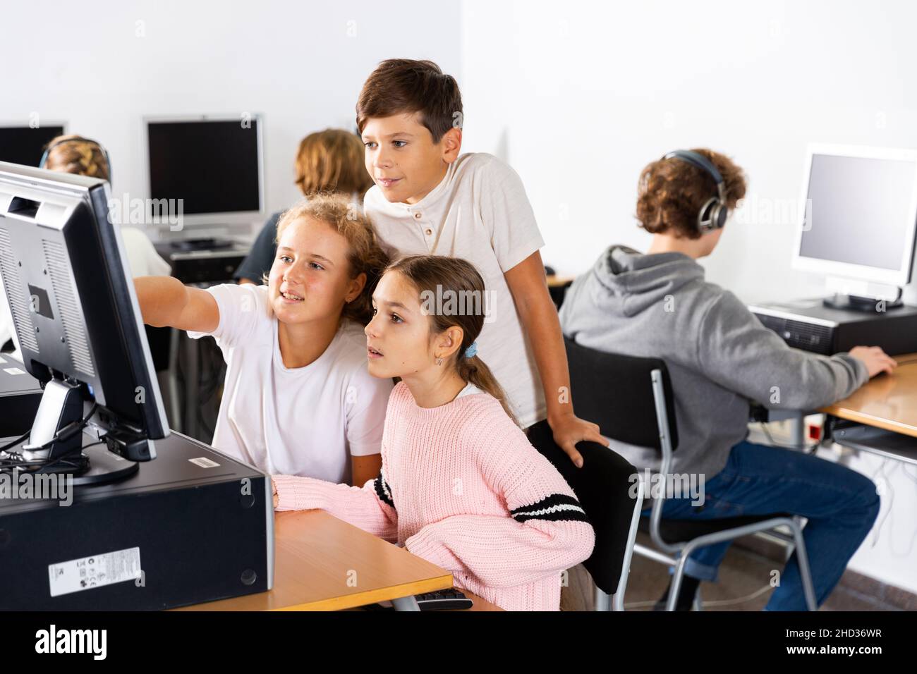 Teenager girls and boys studying in computer lab Stock Photo - Alamy