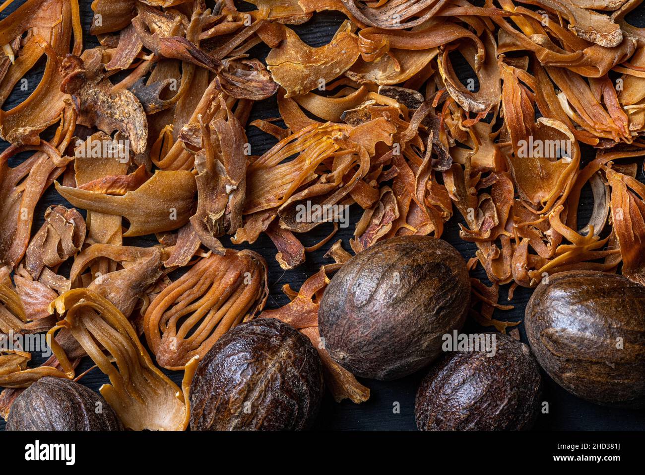 Top view of mace and nutmeg seeds on a table Stock Photo - Alamy