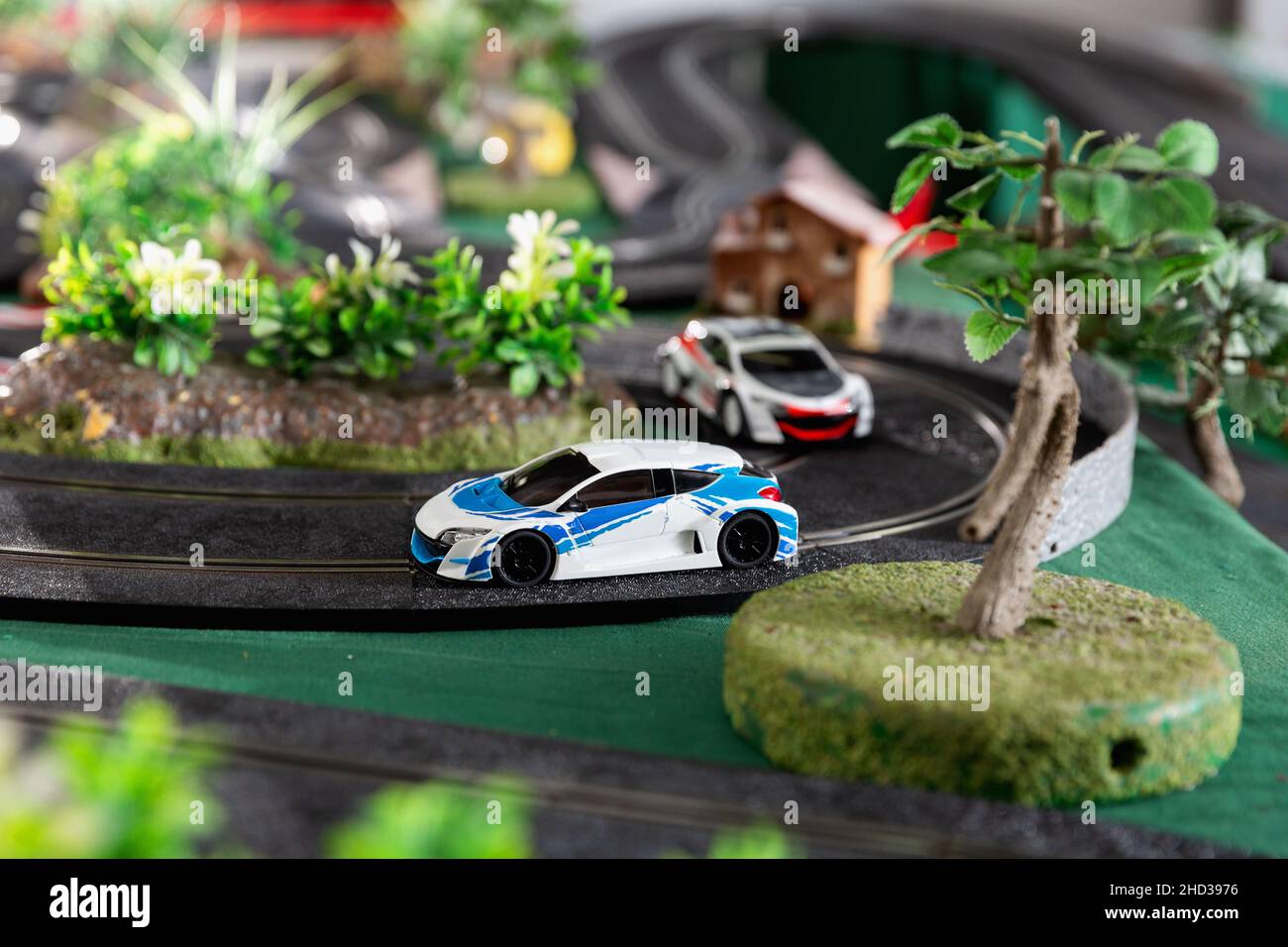 Electric slot cars on the toy race track reader to play Stock Photo - Alamy