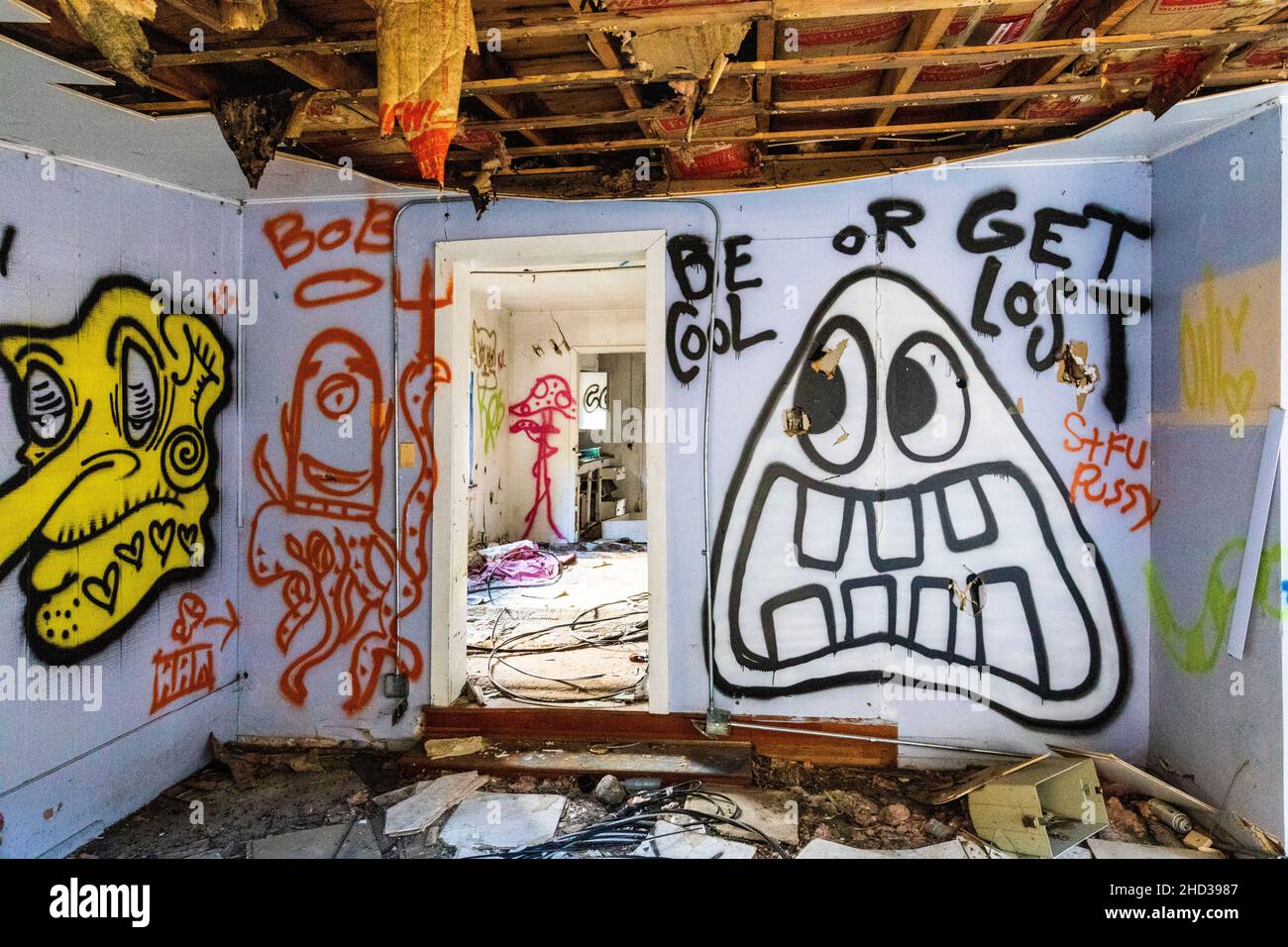 Shot of ruins of an old and dirty building with graffiti on the wall ...