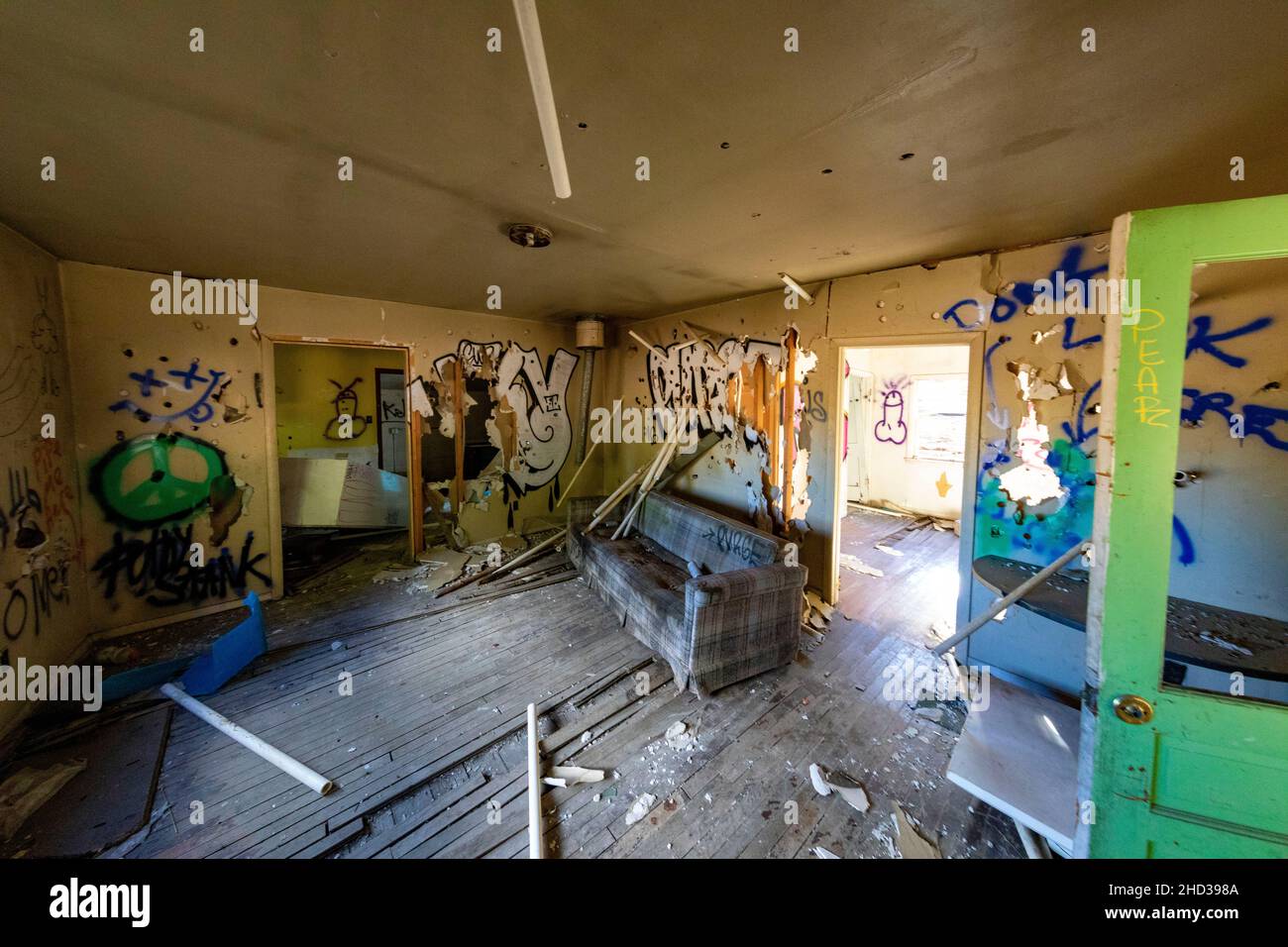 Shot of ruins of an old and dirty building with graffiti on the wall ...