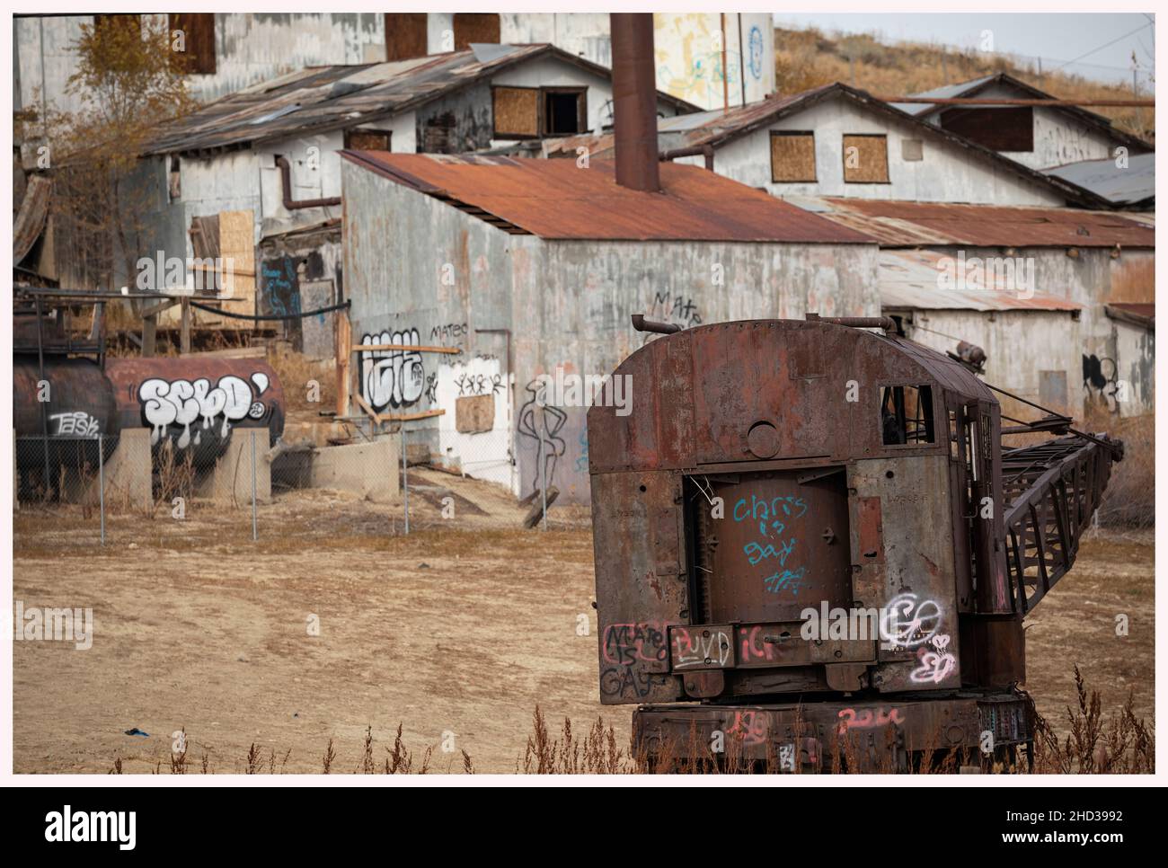 Shot of ruins of old and dirty buildings and an iron structure with ...