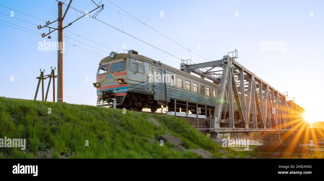 Train railway bridge summer dawn carriages. panorama Stock Photo - Alamy
