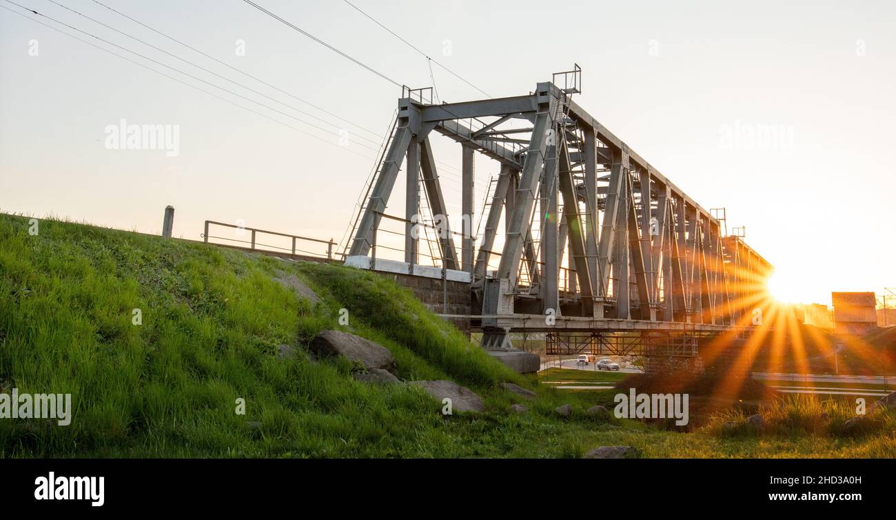 Metal railway bridge at dawn. Industrial landscape Stock Photo - Alamy