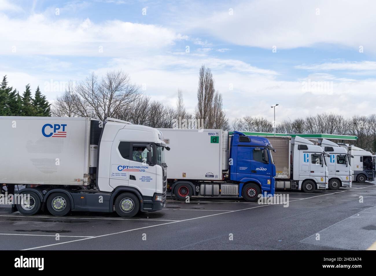 Row of Lorries station Stock Photo - Alamy