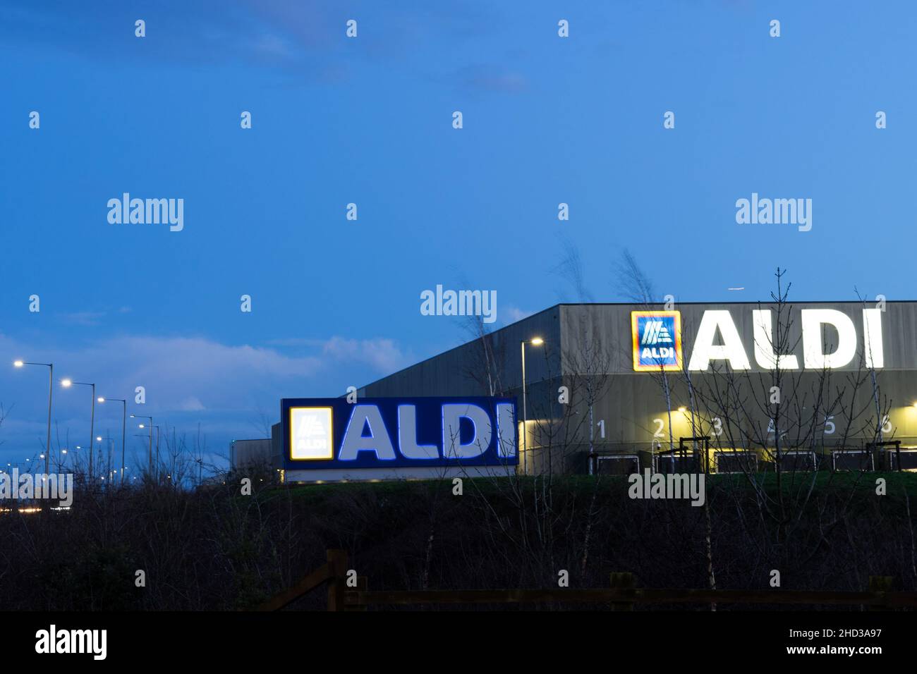 Store logo at night for ALDI supermarket England UK Stock Photo - Alamy