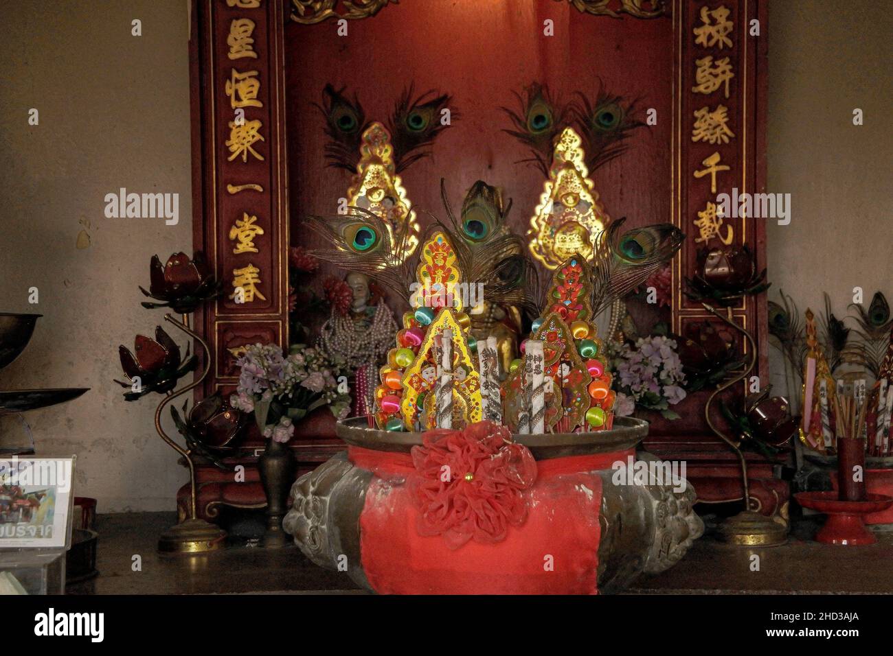A close up view of the ornate shrine at the Rong Kuak Shrine, a Hakka ...