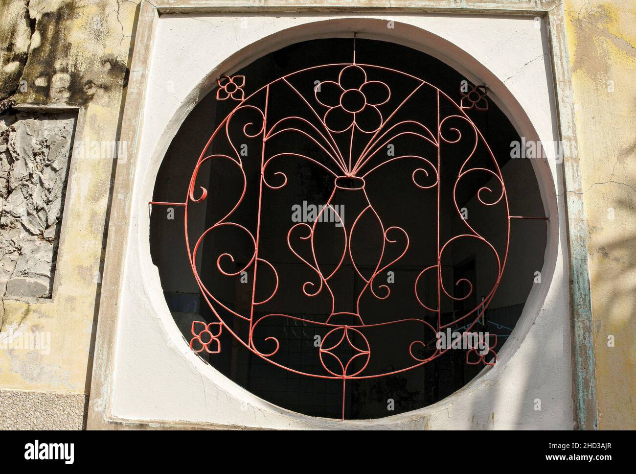 A close up view of an ornate round metal window at the Rong Kuak Shrine ...