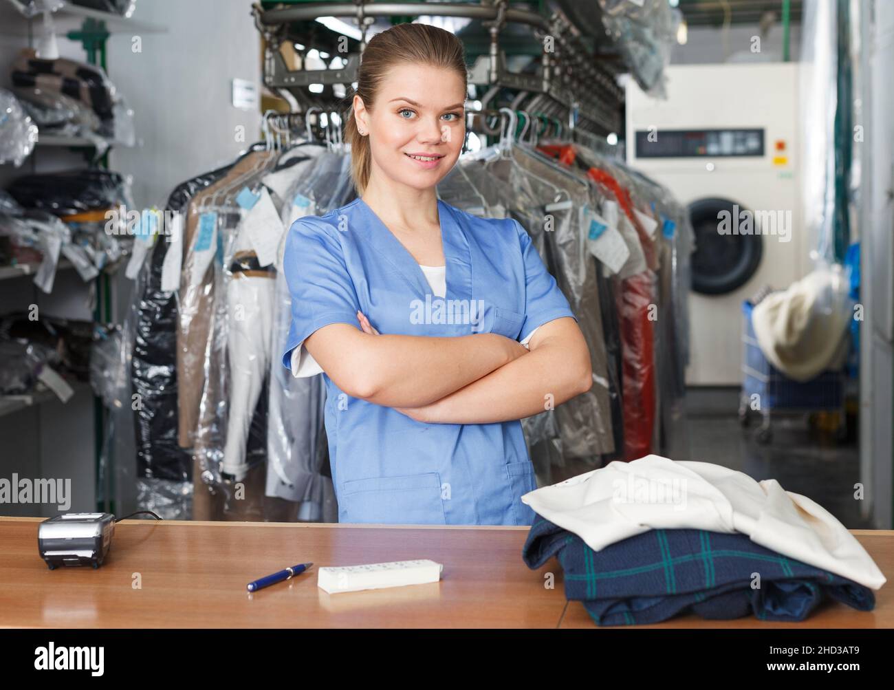 female worker of modern dry cleaner salon Stock Photo - Alamy