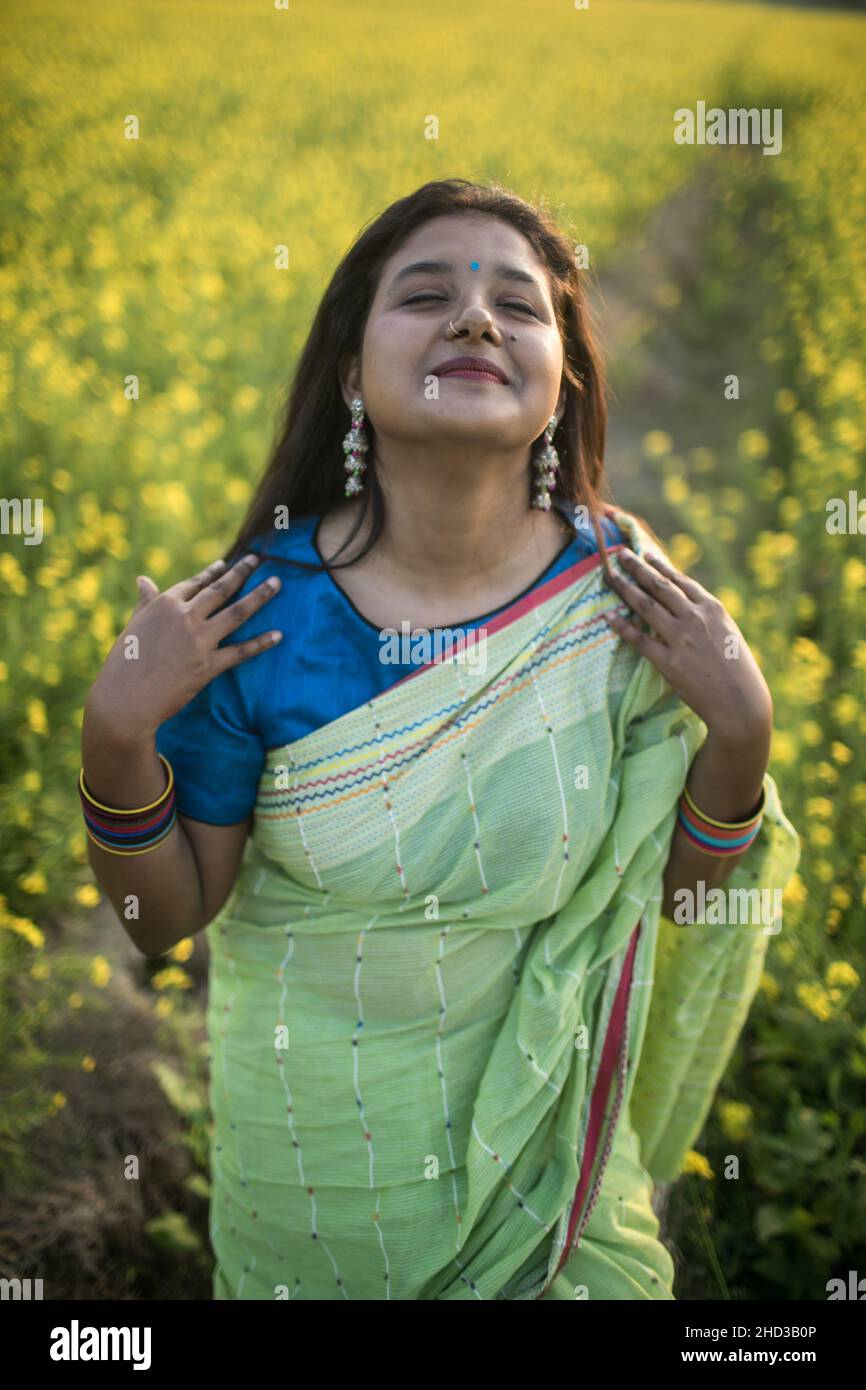 Dhaka, Bangladesh. 31st Dec, 2021. A woman poses for a photo at a ...