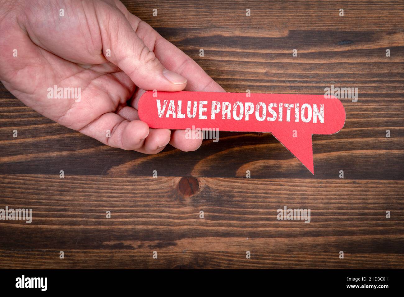 Value Proposition. Red speech bubble on a wooden background Stock Photo ...