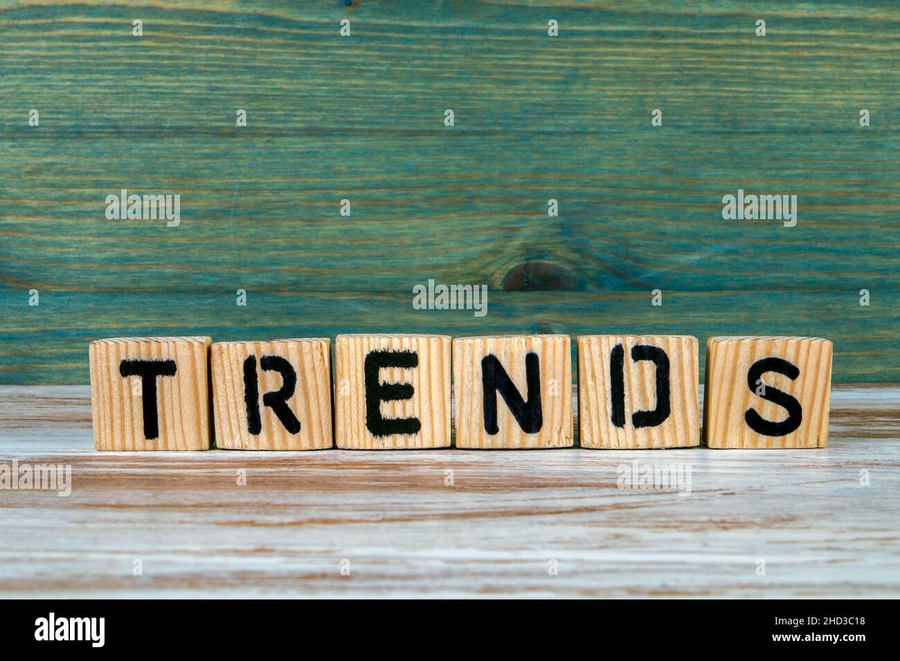 Trends. Word from wooden letters on a white and green background Stock ...