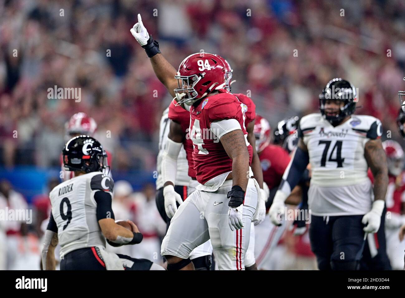 Cincinnati Bearcats quarterback Desmond Ridder (9) is sacked by Alabama ...