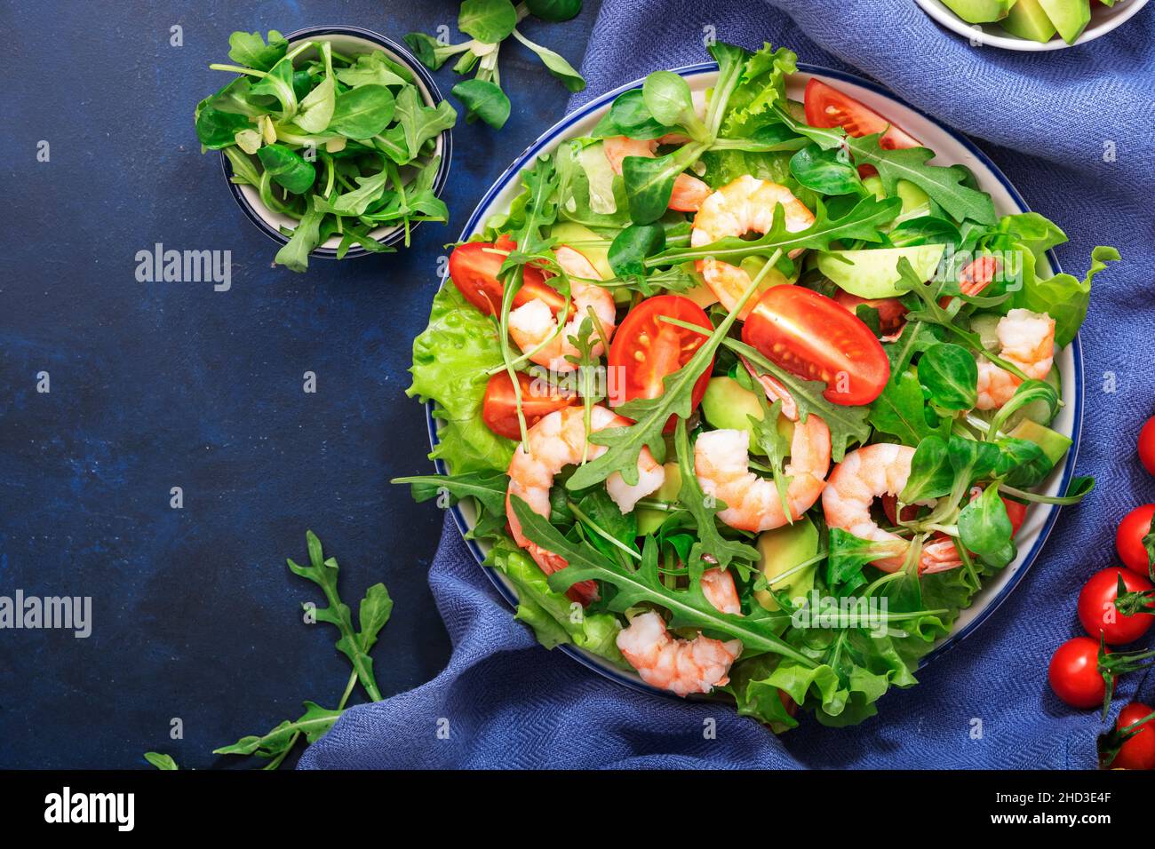Fresh spring shrimp salad with tomatoes, arugula, avocado, and olive ...
