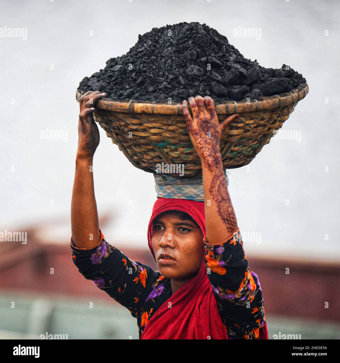 Woman carries coal in basket hi-res stock photography and images - Alamy