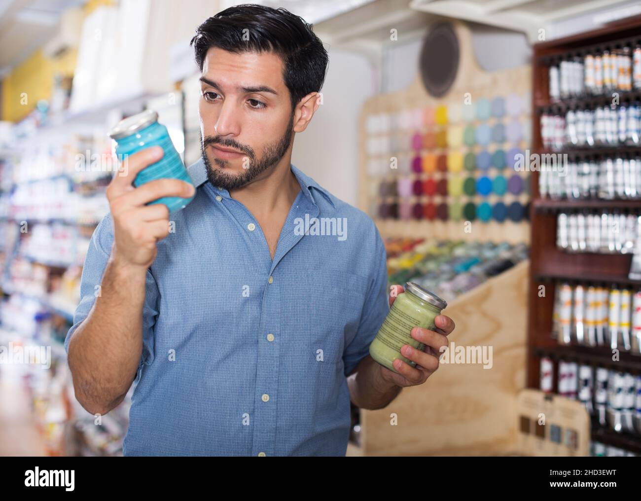 man choosing paints Stock Photo - Alamy