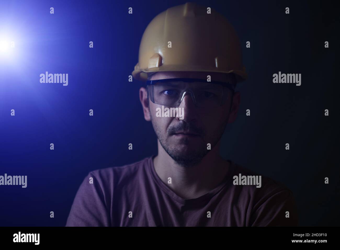 Miner face on black background. Head tired miner in helmet and glasses ...