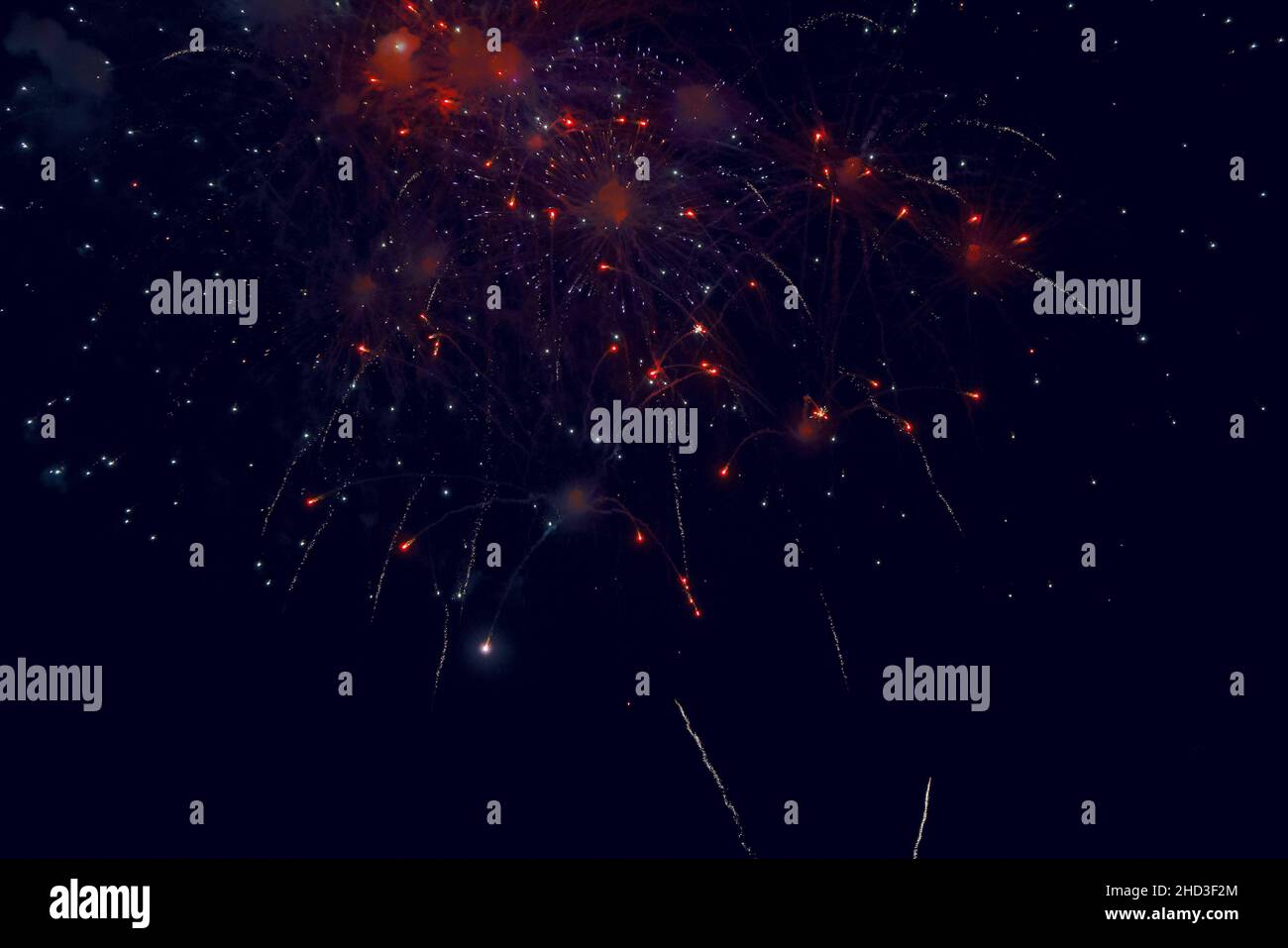 fireworks display at night skies with colorful lights and falling ...