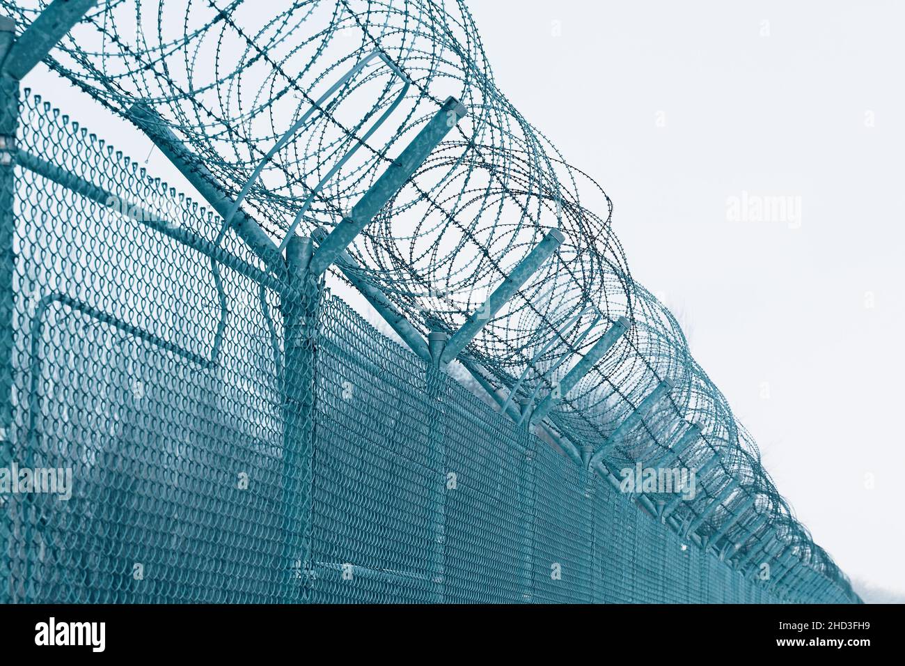 Prison fence. Barbed wire Stock Photo - Alamy