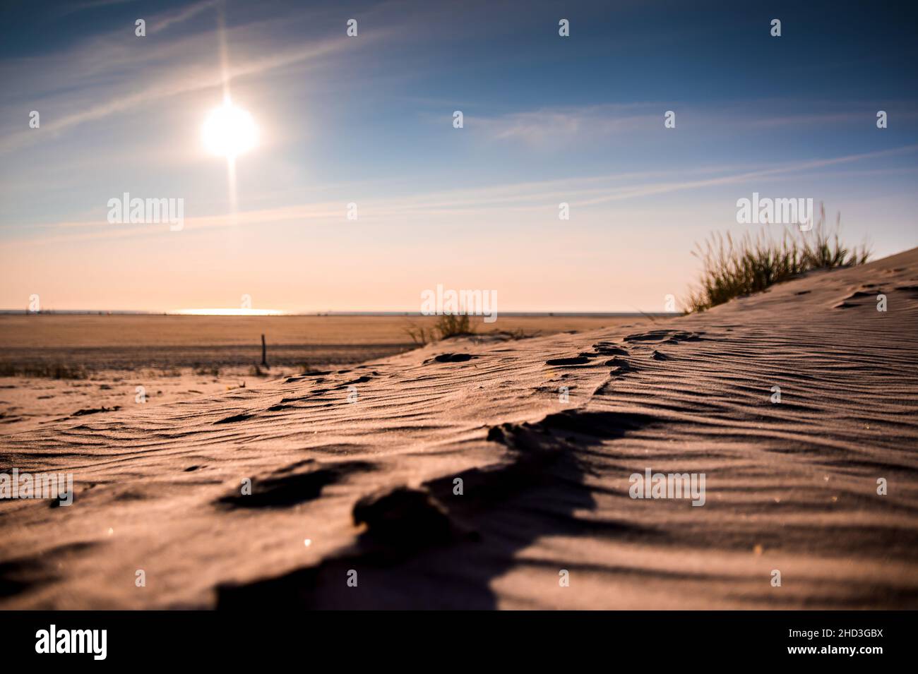 Sundowner at the beach with sand and sunset / sunrise Stock Photo - Alamy