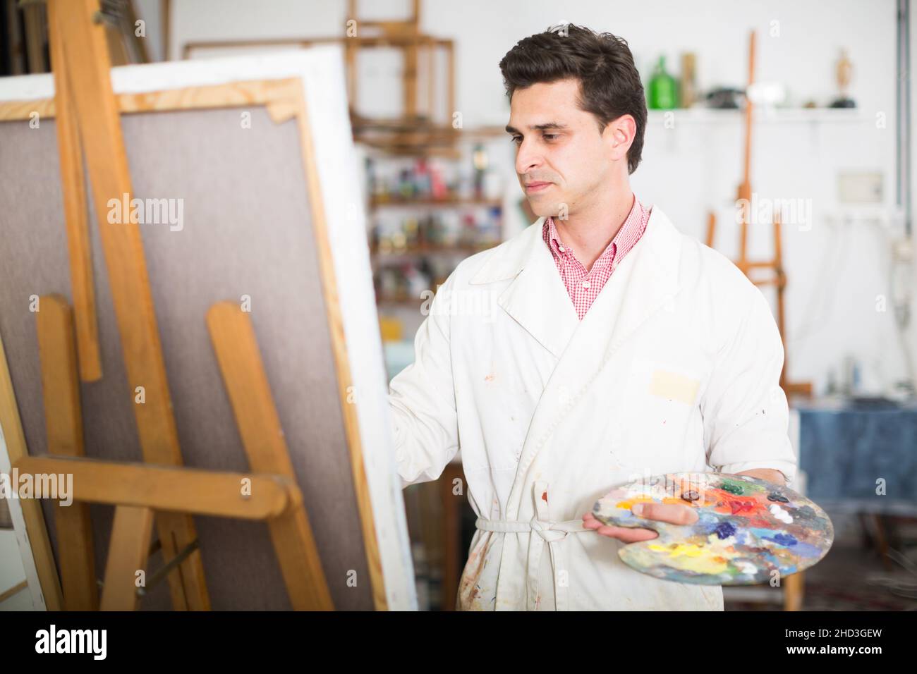 Male artist drawing in studio Stock Photo - Alamy