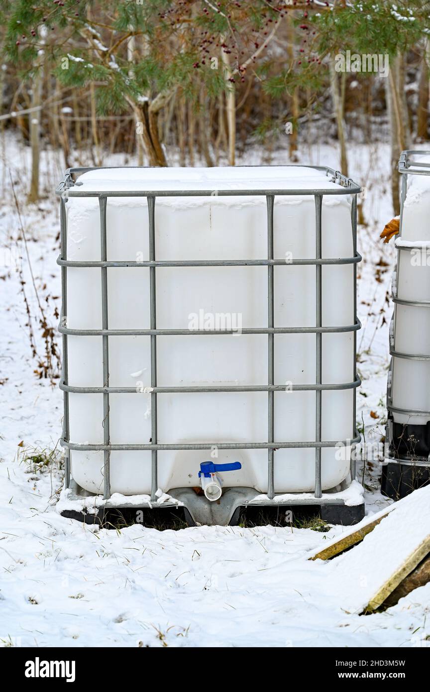 big white tank with tap for a cubic of water Stock Photo - Alamy