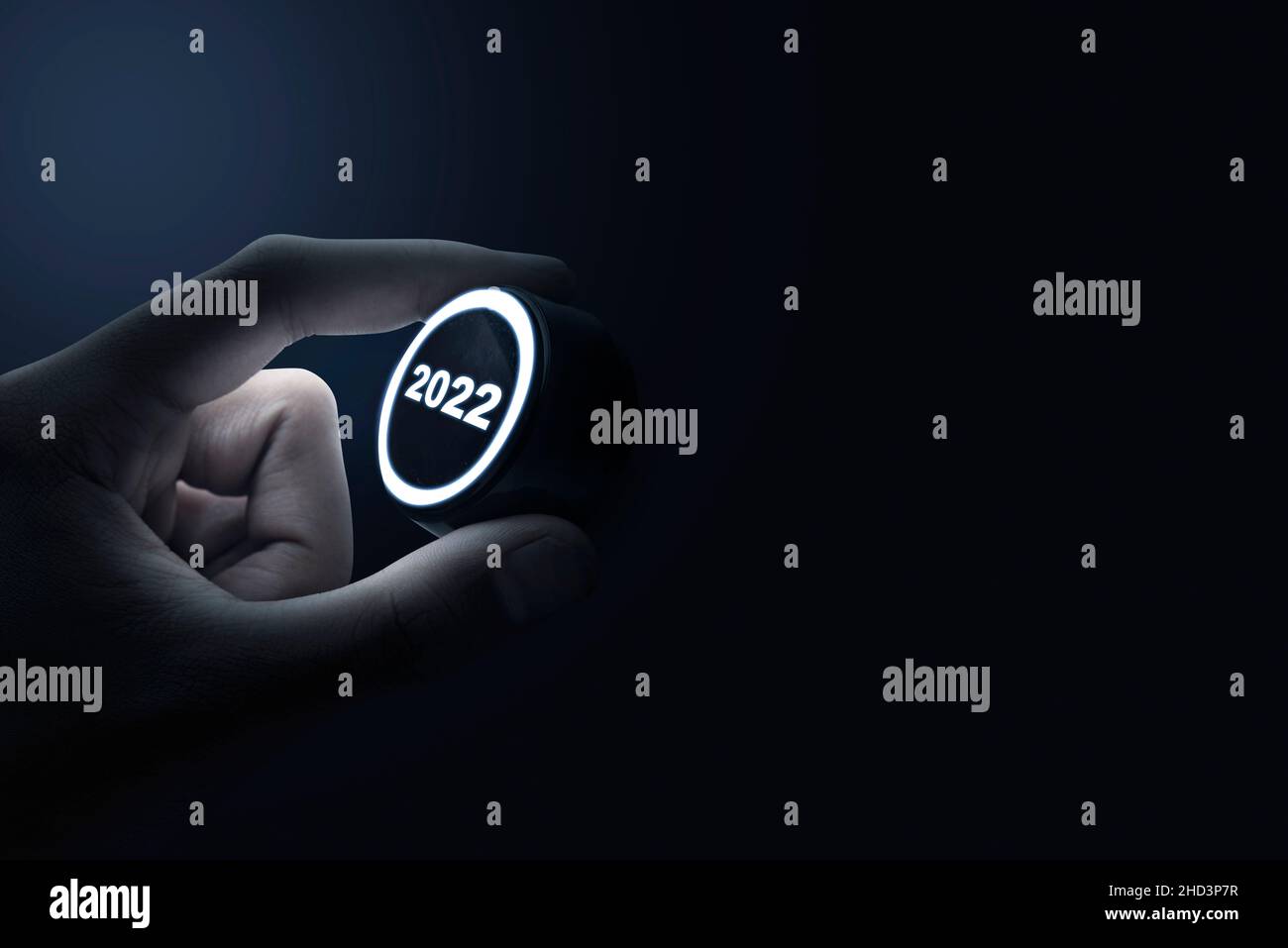 Human hand turning 2022 knob. Happy New Year 2022 Stock Photo - Alamy