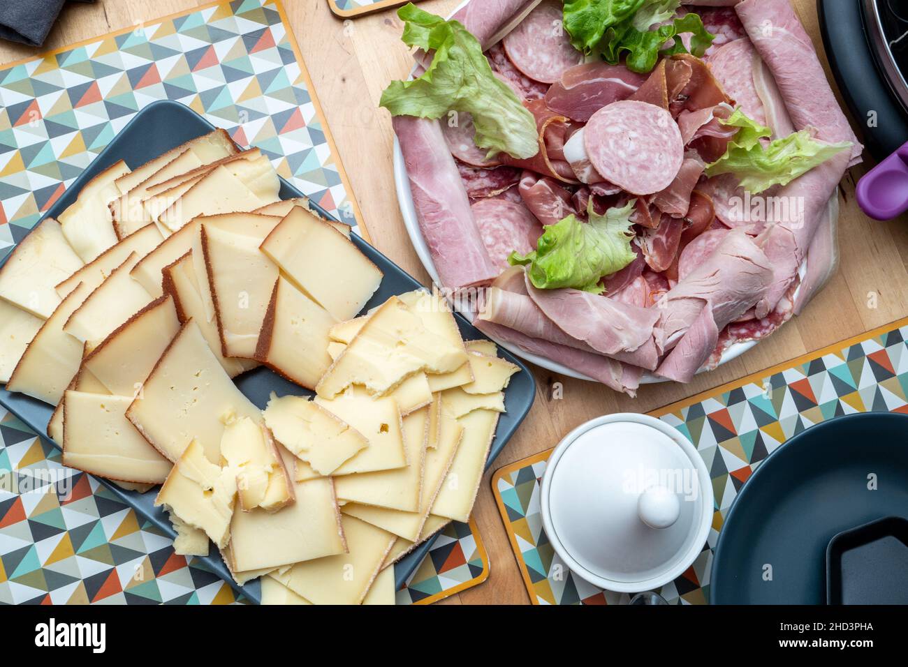 Raclette cheese and meat, a french tradition Stock Photo - Alamy