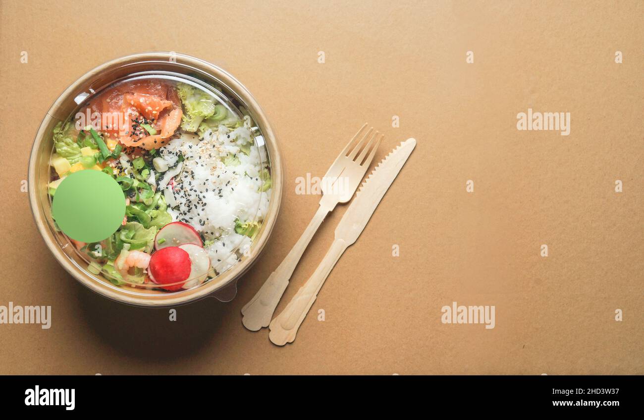 Healthy salad lunch with salmon in craft-paper recycled bowl packages ...