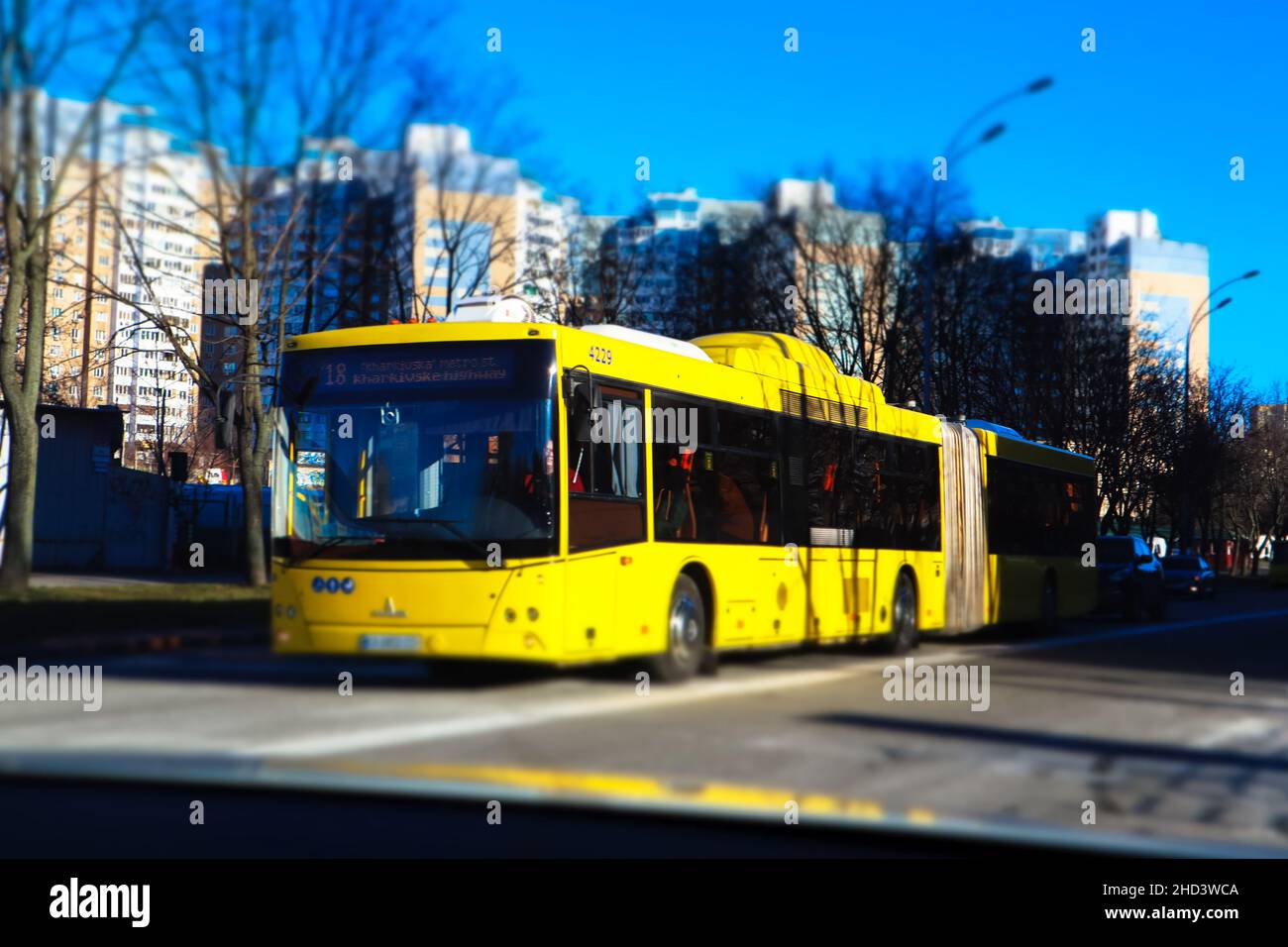 Kiev, Ukraine, January 2, 2022. A large yellow bus drives down a road ...