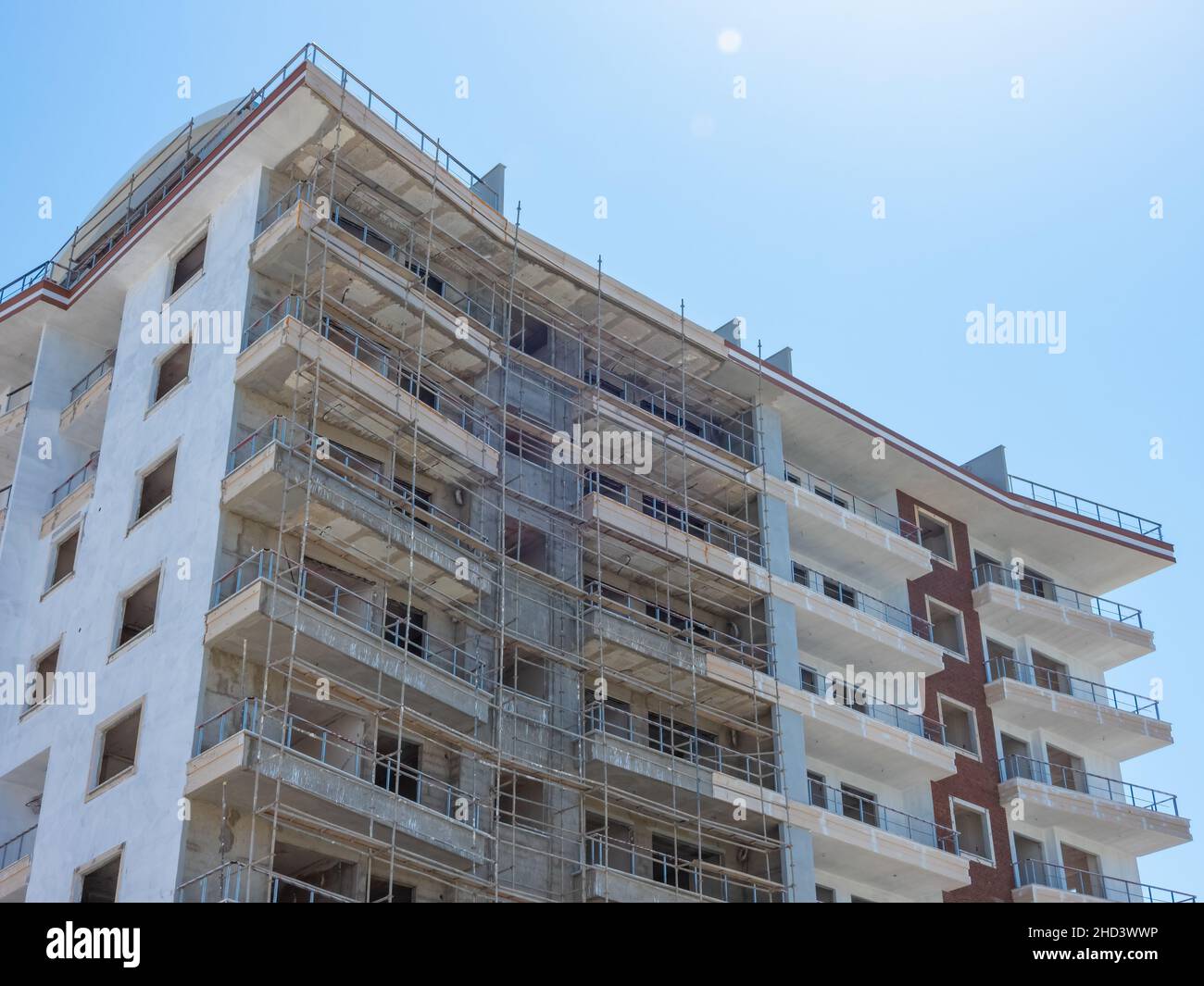 Multi-storey residential building under construction on a sunny day ...