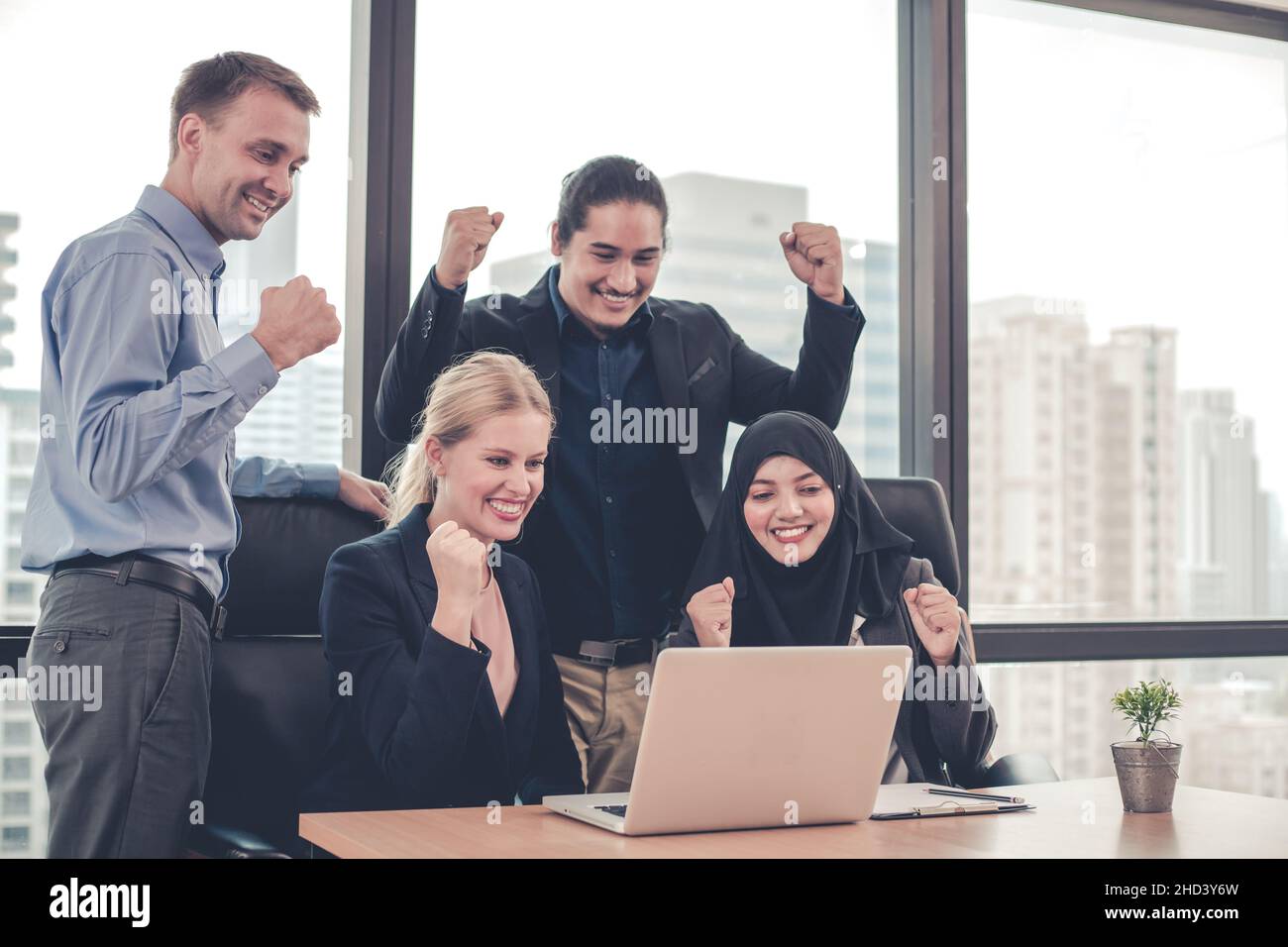Group of office workers are successful working together with a smile on ...