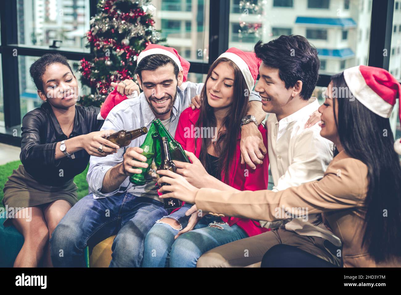 Group of office workers celebrating Christmas and New Year with clink ...