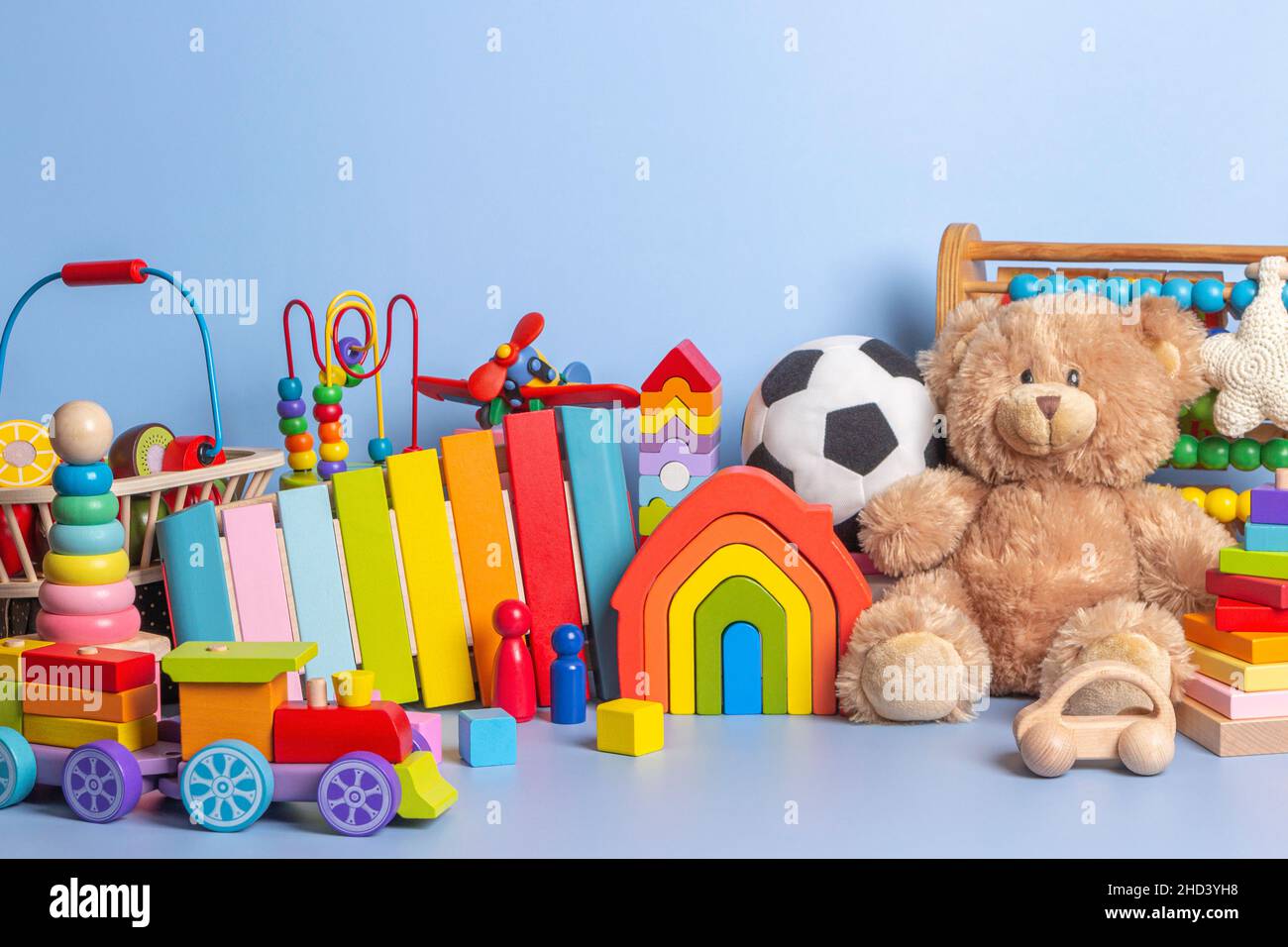 Baby kid toys collection isolated on blue background. Teddy bear ...