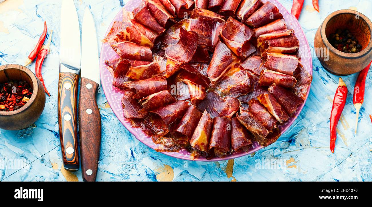 Sliced basturma or beef jerky.Horse meat jerky.Armenian cuisine Stock ...