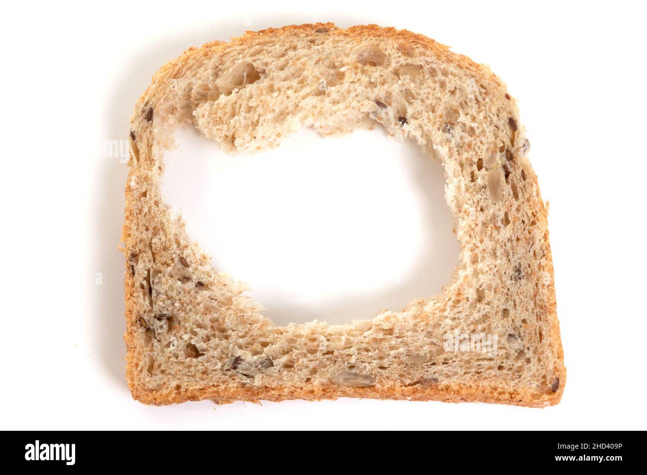 a slice of coreless sandwich bread with eaten away Stock Photo - Alamy