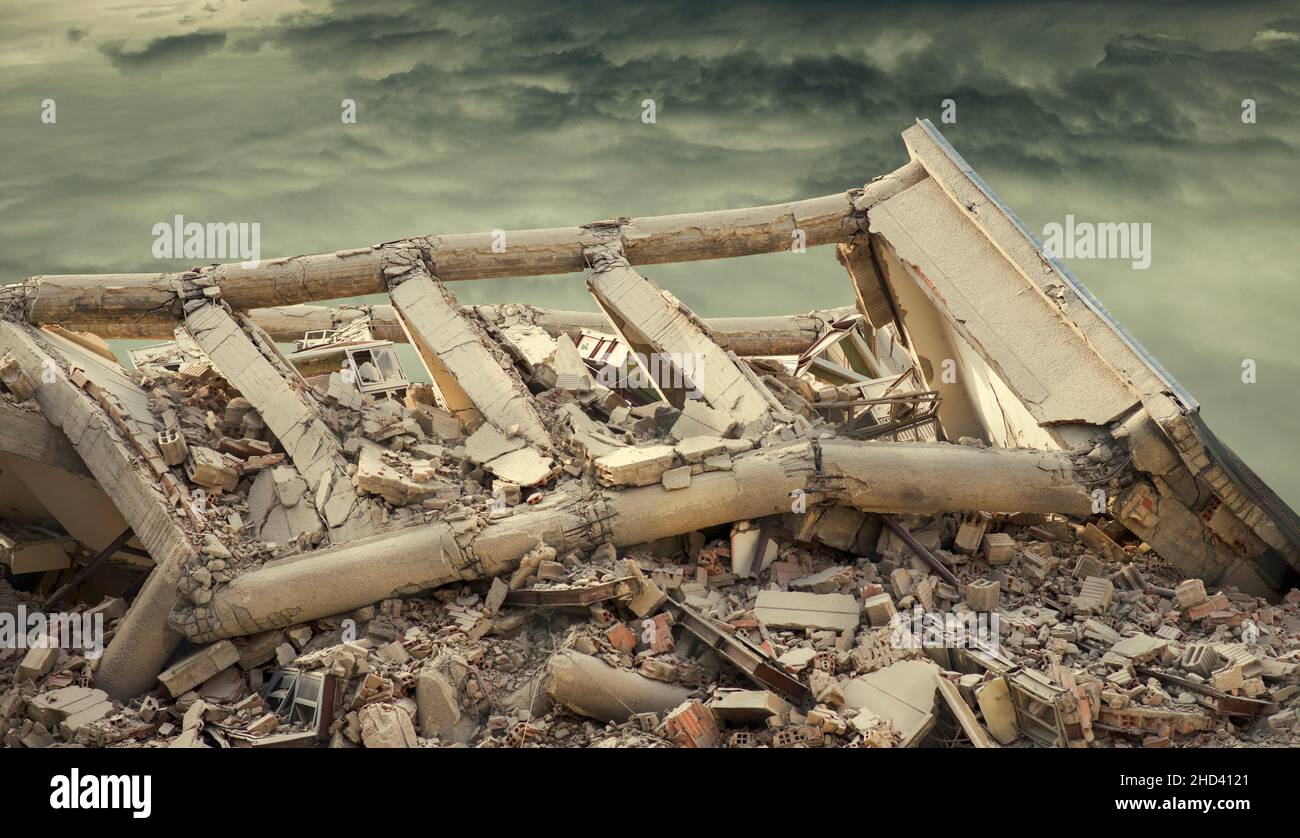 View on a collapsed concrete industrial building with dark dramatic sky ...