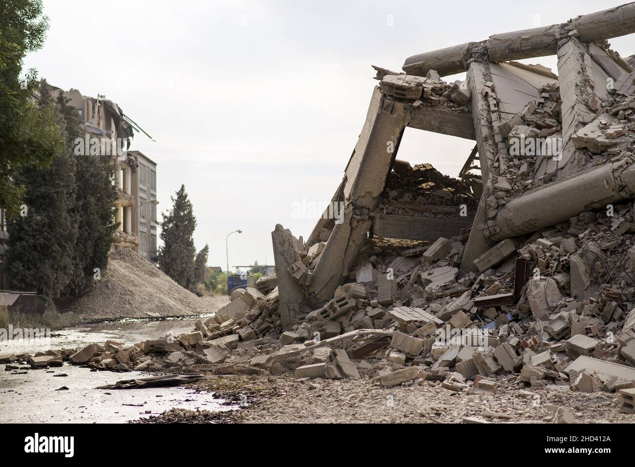 Collapsed concrete industrial building isolated on white. Disaster ...