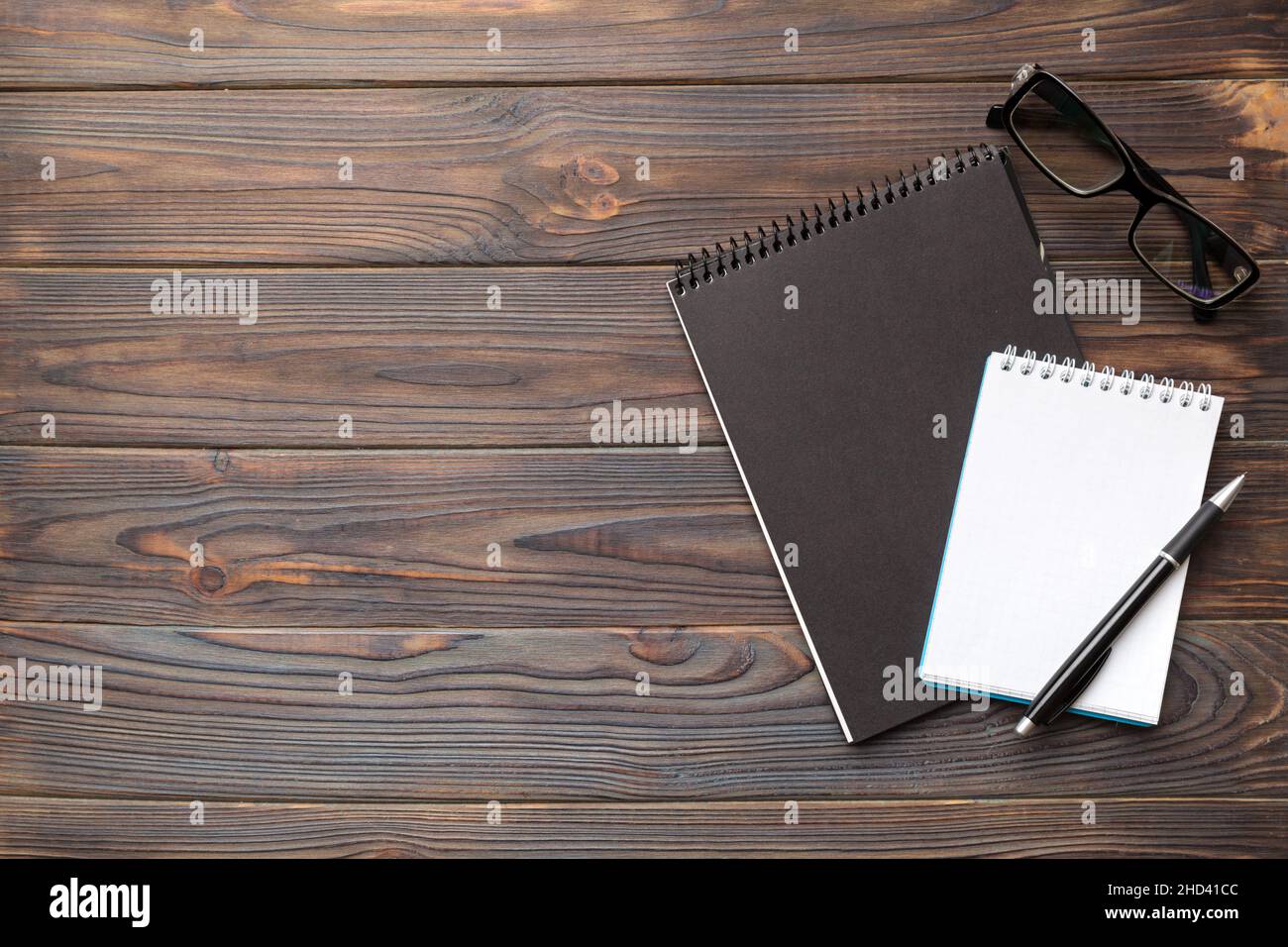 school notebook on a colored background, spiral black notepad on a ...