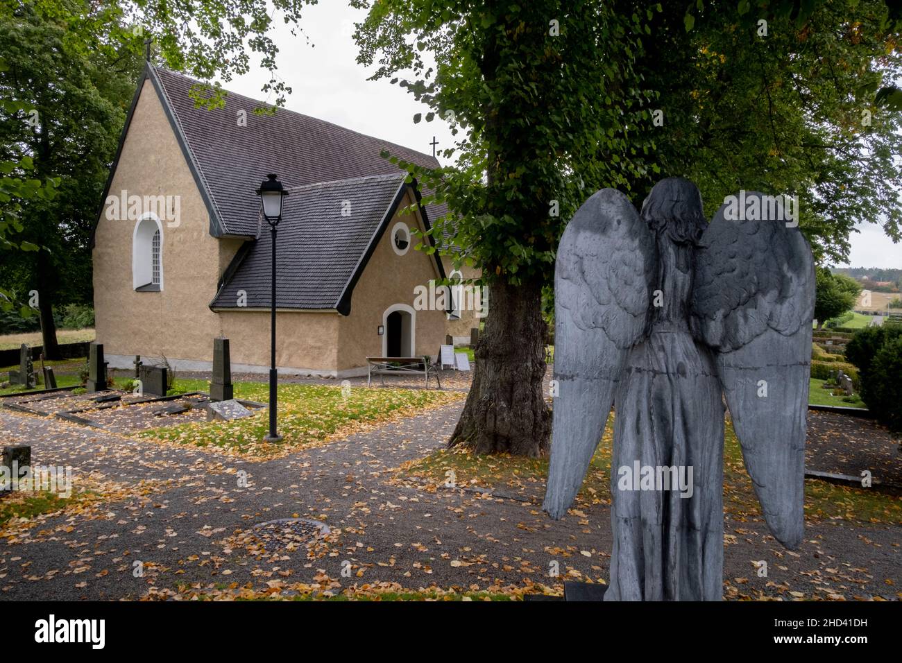 The angel guards over Hammarby church Stock Photo - Alamy