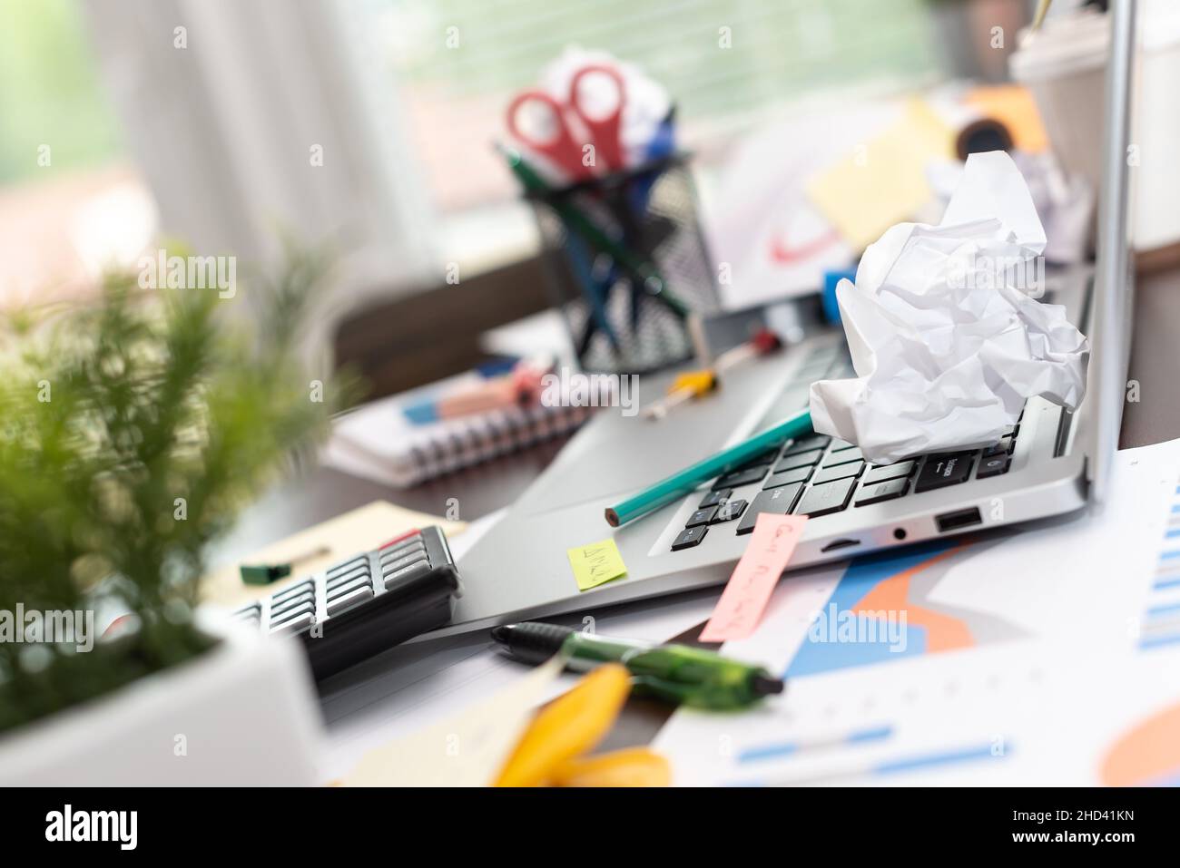 Messy and cluttered office desk Stock Photo - Alamy