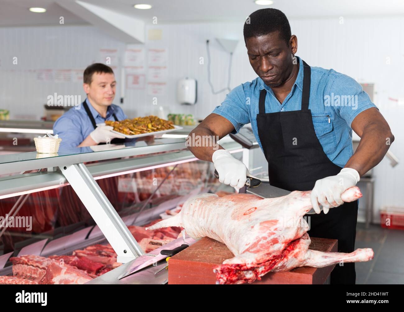 Butcher Cutting Lamb Carcass Stock Photo Alamy