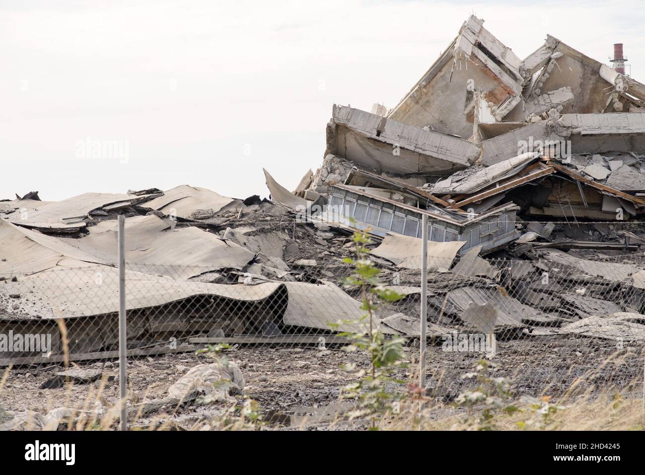 Industrial concrete building destructed by strike. Disaster scene full ...