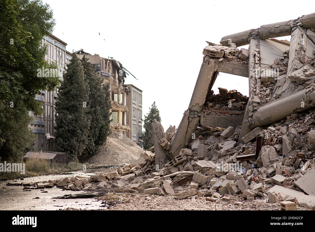 Collapsed concrete industrial building isolated on white. Disaster ...