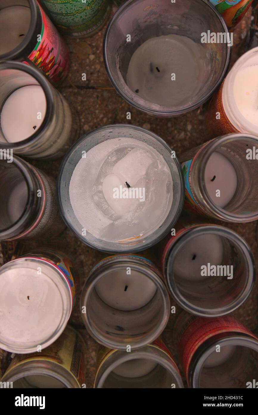 Many jars of lit candles as wishfully thinking for hopes and dreams to ...