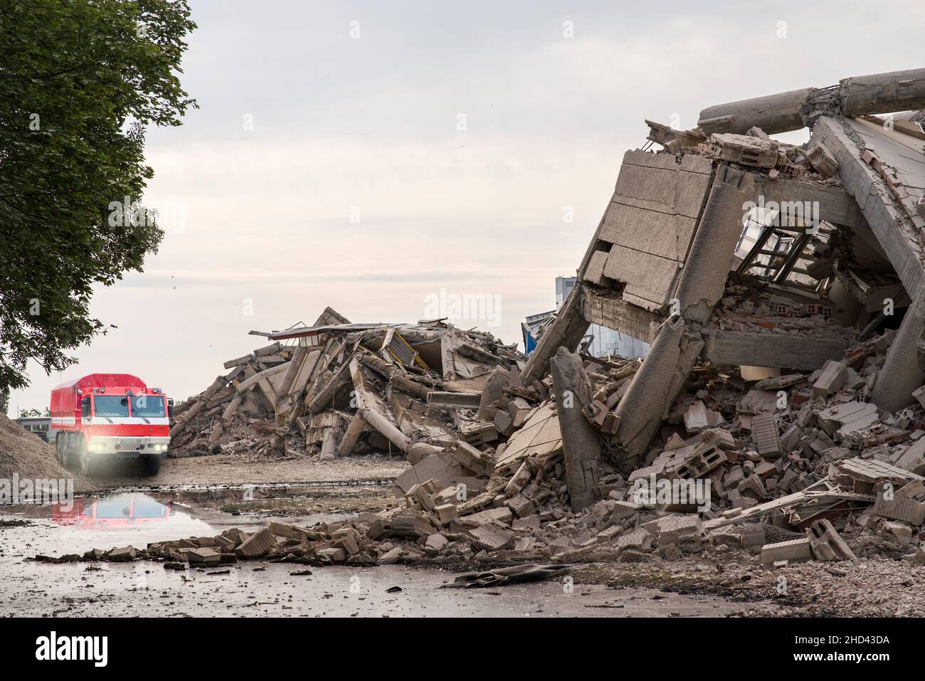 Fire brigade car among collapsed concrete city buildings Stock Photo ...
