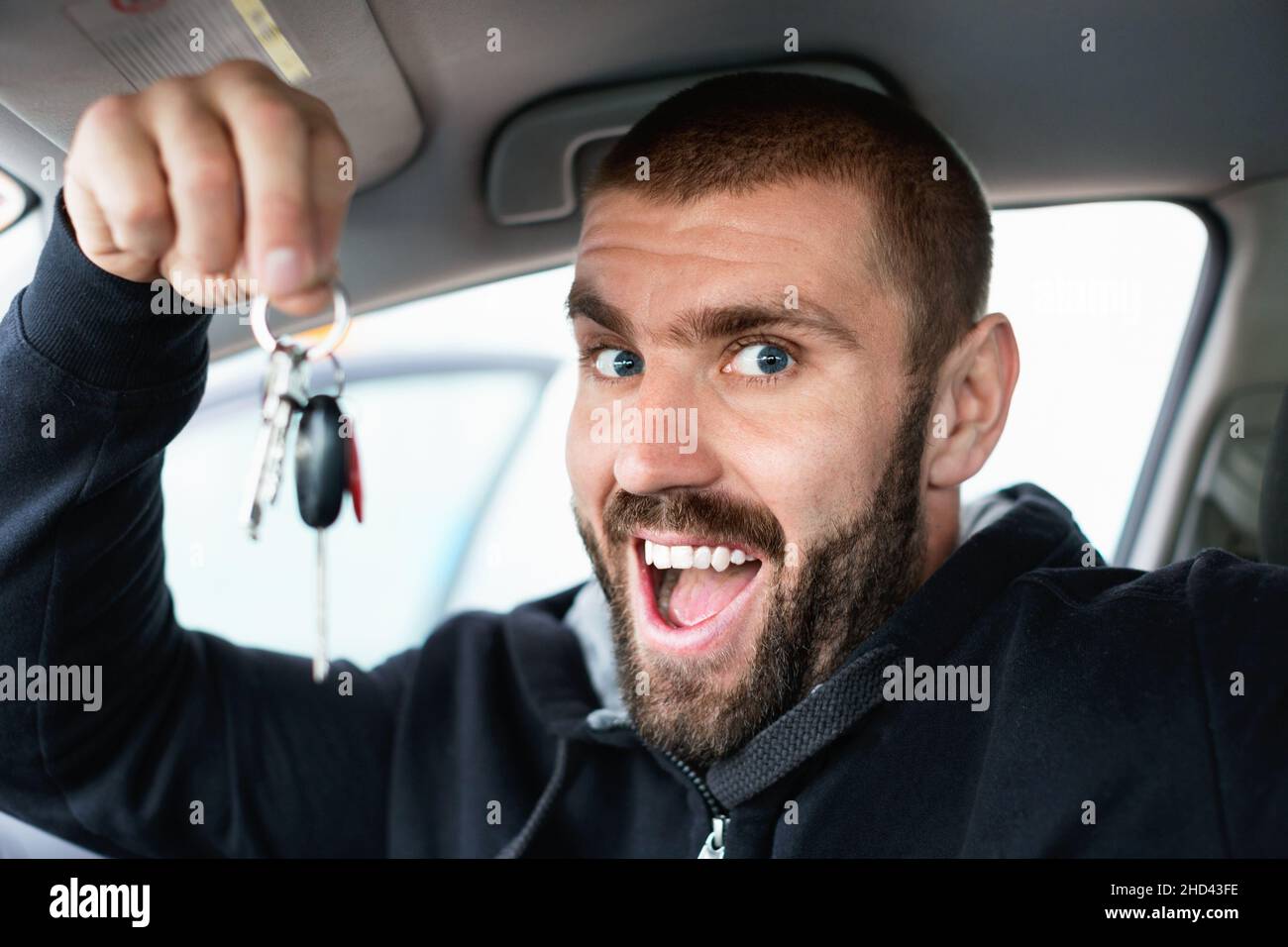 Man shows keys from new car Stock Photo - Alamy