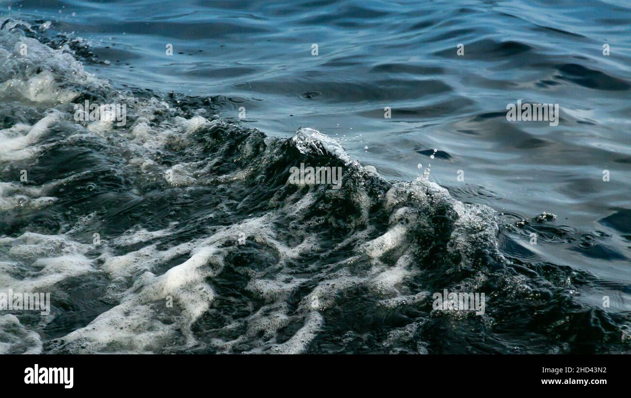 Water Splash from Wake of a Boat. White foam and Bubbles on Crest of ...