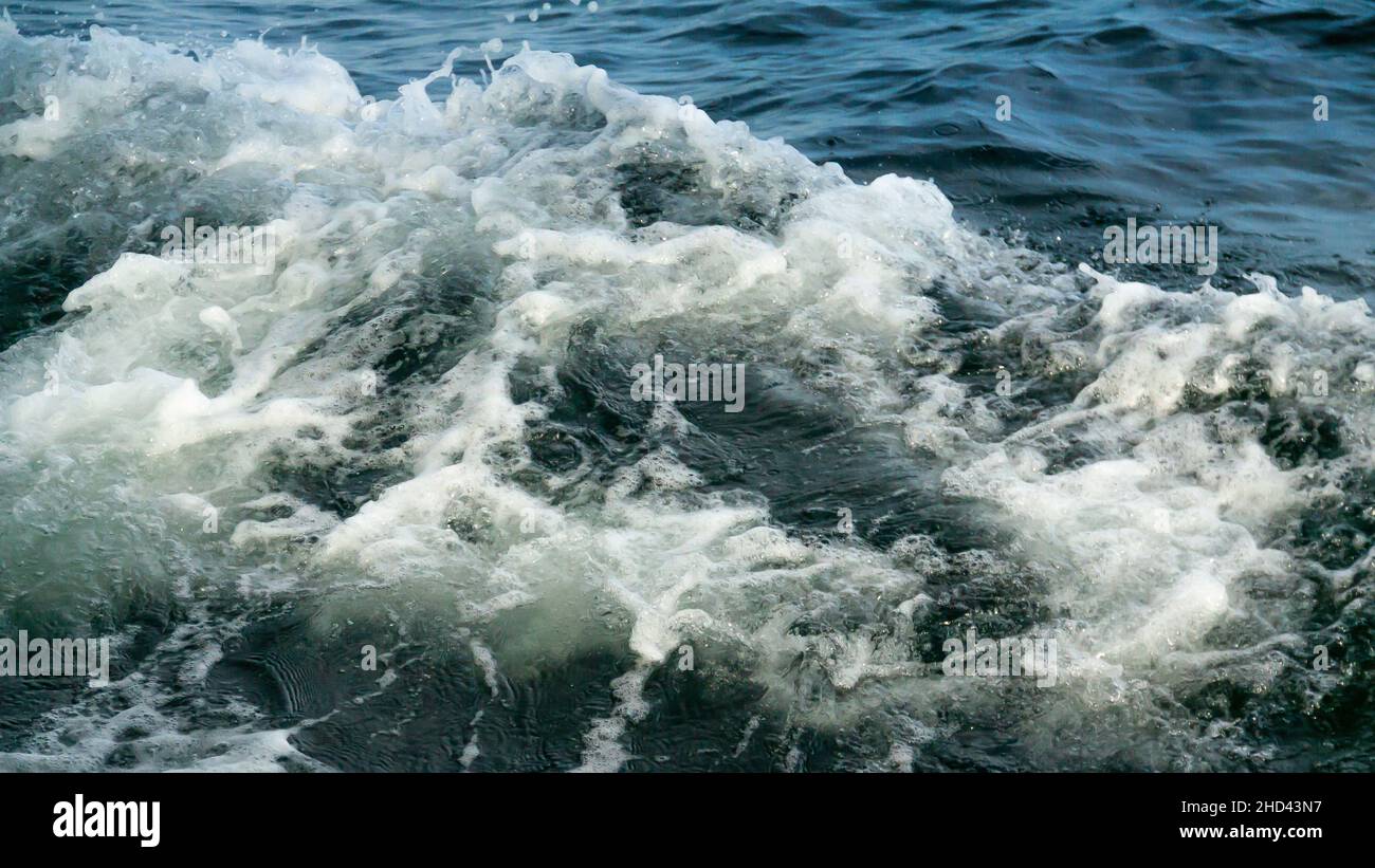 Water Splash from Wake of a Boat. White foam and Bubbles on Crest of ...
